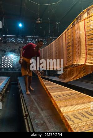 Indian worker drying textiles after manual Screen Printing, Rajasthan ...