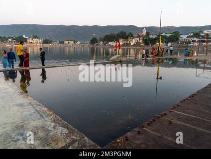Indian pilgrims in Barhama lake and bathing ghats, Rajasthan, Pushkar ...