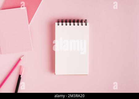 Notepad office supplies colored surface Stock Photo - Alamy