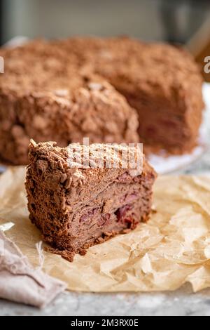 Napoleon cake with custard is decorated with cherries and grated ...