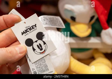 Miniso toy label with company logo in the hands of a customer in a ...