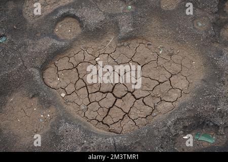 closeup of an unusual texture on the broken ceramic pieces of the floor ...