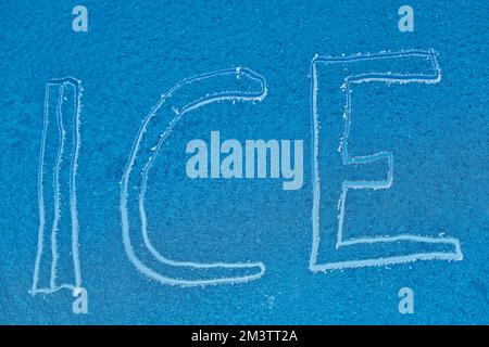The word 'ICE' etched onto a frozen windscreen during subzero ...