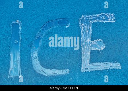 The word 'ICE' etched onto a frozen windscreen during subzero ...