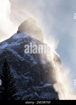 snow and ice deposited on the rock face of a mountain in winter Stock ...
