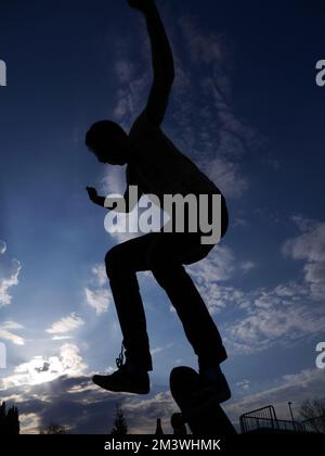 silhouette skateboarder shadow tricks outside Stock Photo - Alamy