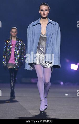 A model walks the runway during the Qatar Fashion United by CR at 974 ...