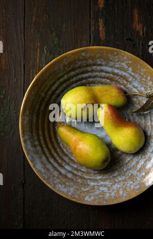 Three sweet juicy pears with ceramic dish , macro, isolated on white background Stock Photo - Alamy