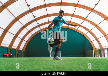 Cinematic image of a soccer freestyle player making tricks with the ...