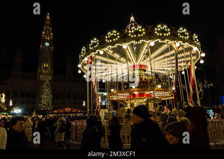 Traditional merry-go-round at Wiener Christkindlmarkt, Rathaus Platz ...