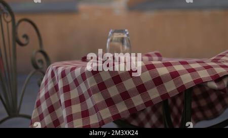 Milliken Table Linens Checkpoint tablecloth flowing in the wind with ...