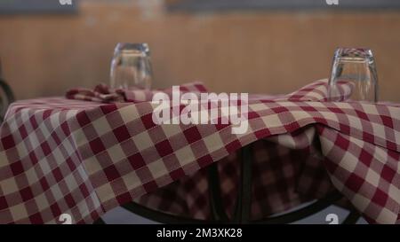 Milliken Table Linens Checkpoint tablecloth flowing in the wind with ...