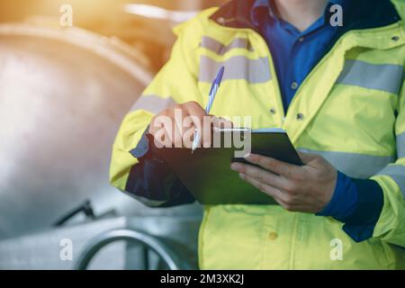 Closeup of the worker checking the machinery Stock Photo - Alamy
