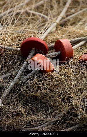 longline fishing net, sand color with red orange and yellow details ...