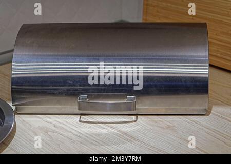 Closed stainless steel bread box at kitchen countertop Stock Photo - Alamy