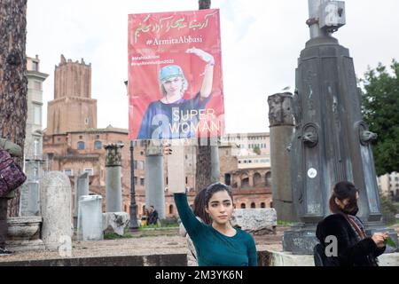 Rome, Italy. 17th Dec, 2022. An Iranian girl shows a banner to remember ...