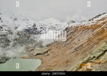 Clouds lying in the valley at Pasterze Hochalpengletscher ...