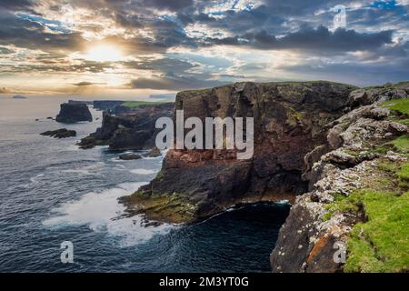 The dramatic cliffs under the Eshaness Lighthouse; Shetland islands ...