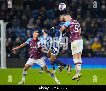 Taylor Harwood-Bellis #5 of Burnley competes for the ball with Mallik ...