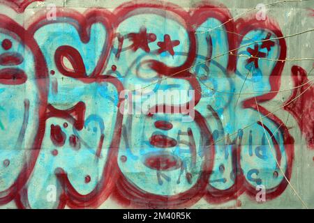 White, blue letters with red dashes, dots, circles, and lines with ...