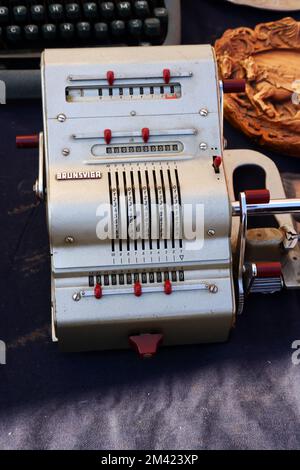 Ancient calculator machine on table for exhibition Stock Photo - Alamy