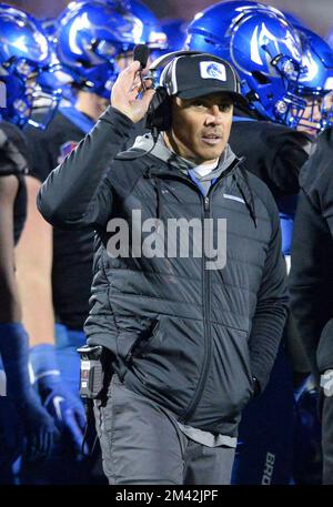 Boise State head coach Andy Avalos checks on an injured player in the ...
