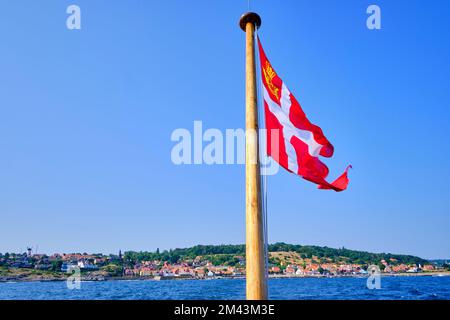 Flying Danish flag at the stern of an excursion boat and picturesque ...