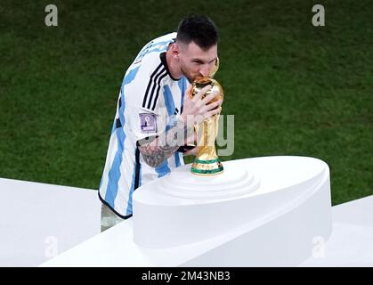Argentina's Lionel Messi kisses the World Cup trophy after the FIFA ...