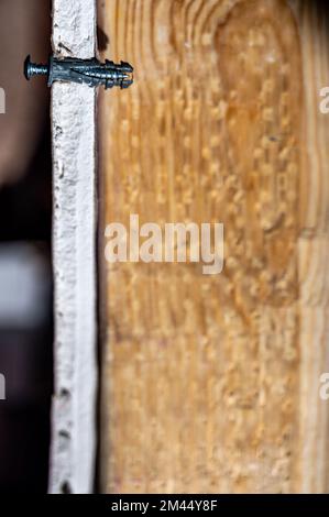 Side view of a drywall mount anchor and screw Stock Photo - Alamy
