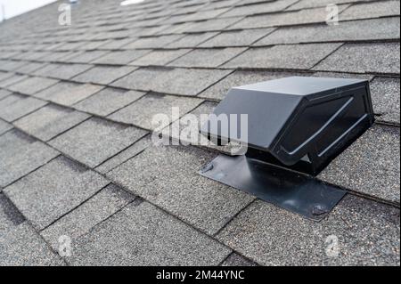Static vent installed on a shingle roof for passive attic ventilation ...