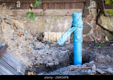 Close-up of a water well pipe with cap sticking out the ground Stock ...