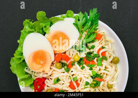 Beautiful Noodle Dish with Green Pea, Eggs, Red Hot Pepper, Greens and ...