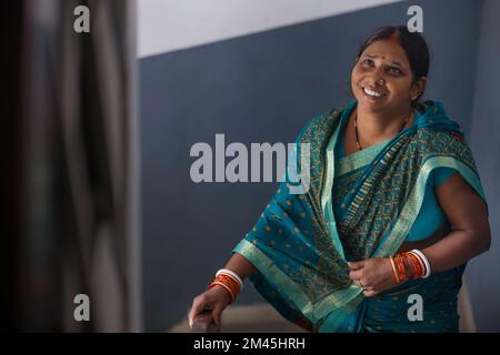 portrait of a smiling indian house maid Stock Photo - Alamy