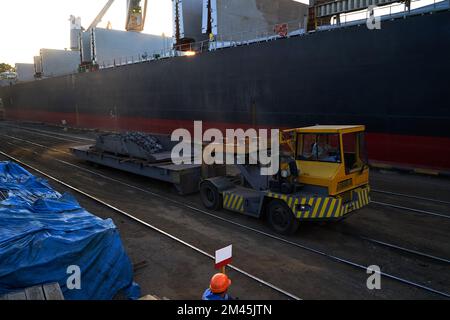 Loading cast iron ingots on ship bulk. Loading metal on ship ...