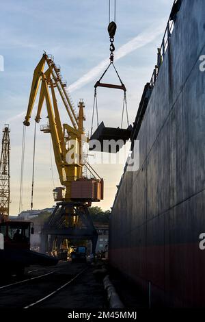 Loading cast iron ingots on ship bulk. Loading metal on ship ...