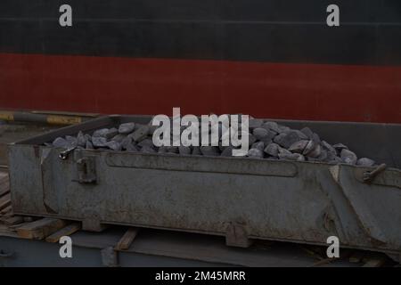 Loading cast iron ingots on ship bulk. Loading metal on ship ...