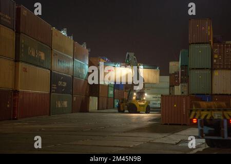 Reach Stacker during operation. Reach-stacker container loader during ...
