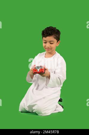 Arab boy pushing toy car Stock Photo - Alamy