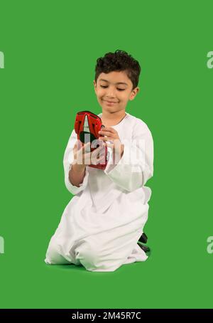 Arab boy pushing toy car Stock Photo - Alamy