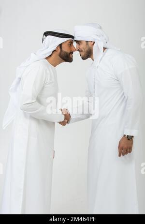 Emirati men greeting each other Stock Photo - Alamy