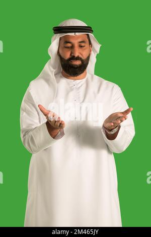 Arab man holding object Stock Photo - Alamy