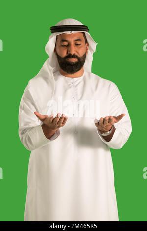 Arab man holding object Stock Photo - Alamy