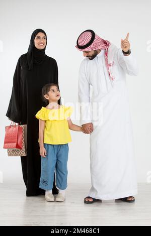 Arab Family with a shopping bag Stock Photo - Alamy