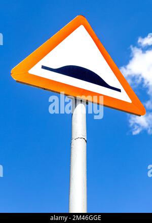 Triangle speed bump road sign against the blue sky. Warning traffic sign Speed bump Stock Photo ...