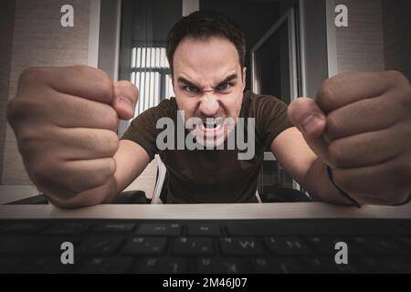 angry man swearing and cursing against information technology and his ...