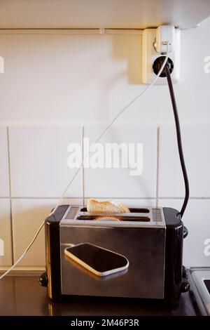 Plug plugged into an electrical outlet, smart electrical outlet ...