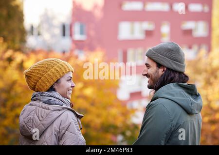 Happy couple in autumn scenery Stock Photo - Alamy