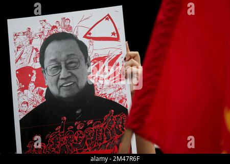 Manila, Philippines. 19th Dec, 2022. Filipino activists carry flags and ...