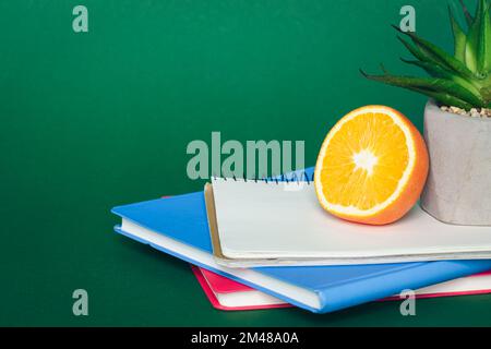 Blank notebooks on orange background Stock Photo - Alamy