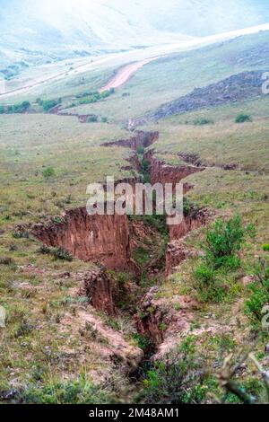 a large crack in the ground after seismic activity Stock Photo - Alamy